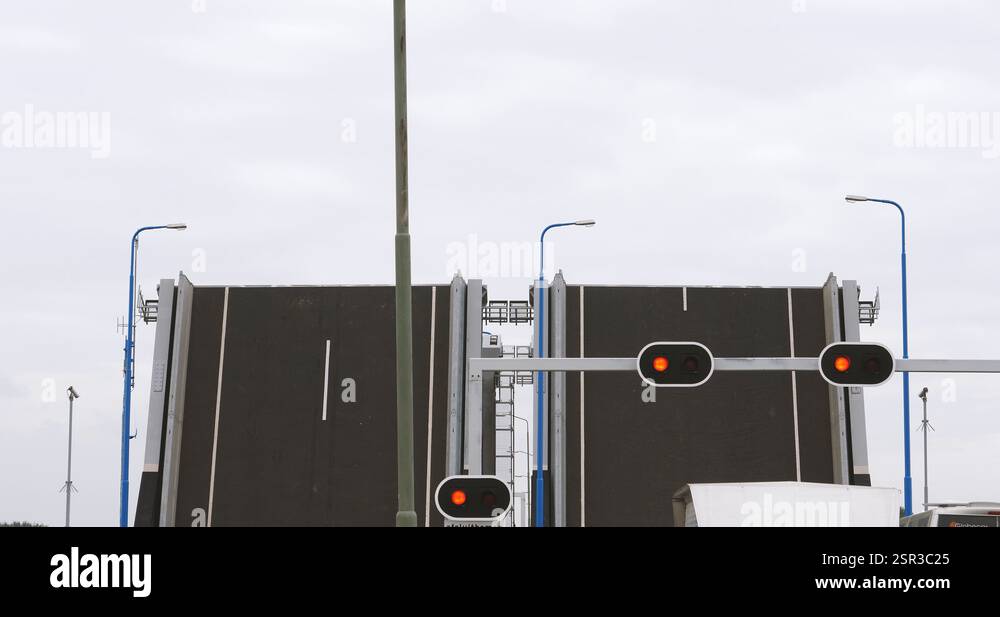 Open drawbridge in Netherlands with cars waiting in front Stock Video ...