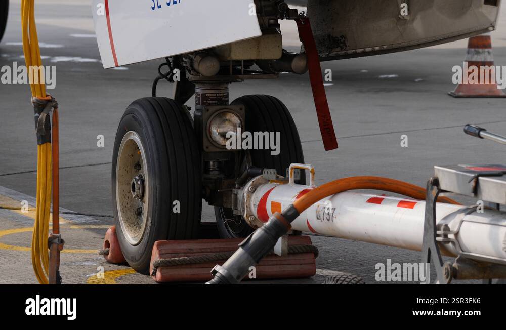 Aircraft ground handling. Fore undercarriage with pushback tug towbar ...