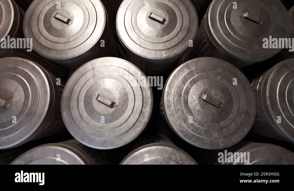 "Steel trash bins stacked together in an endless loop lit by soft light ...