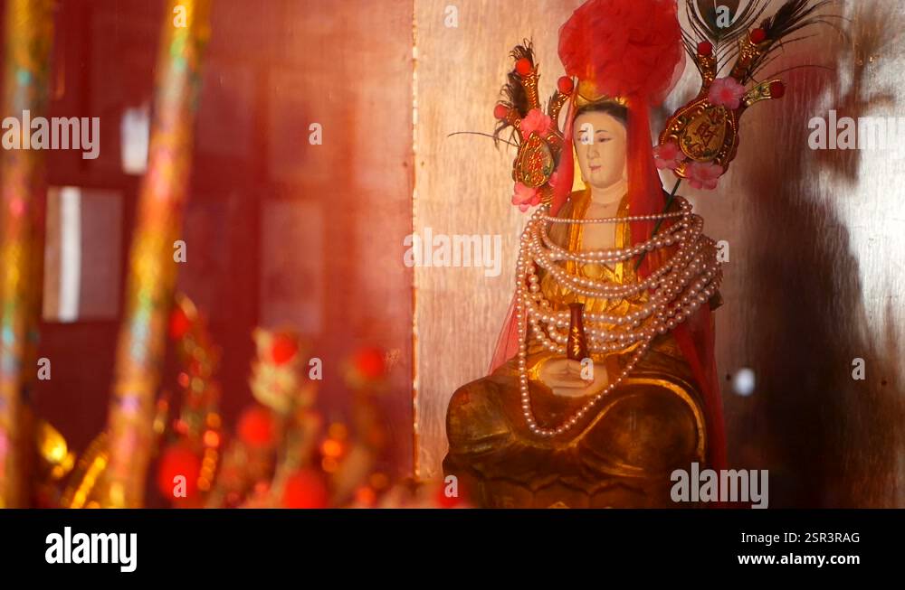 Buddhist traditional statues of chinese sacred gods on the altar inside ...