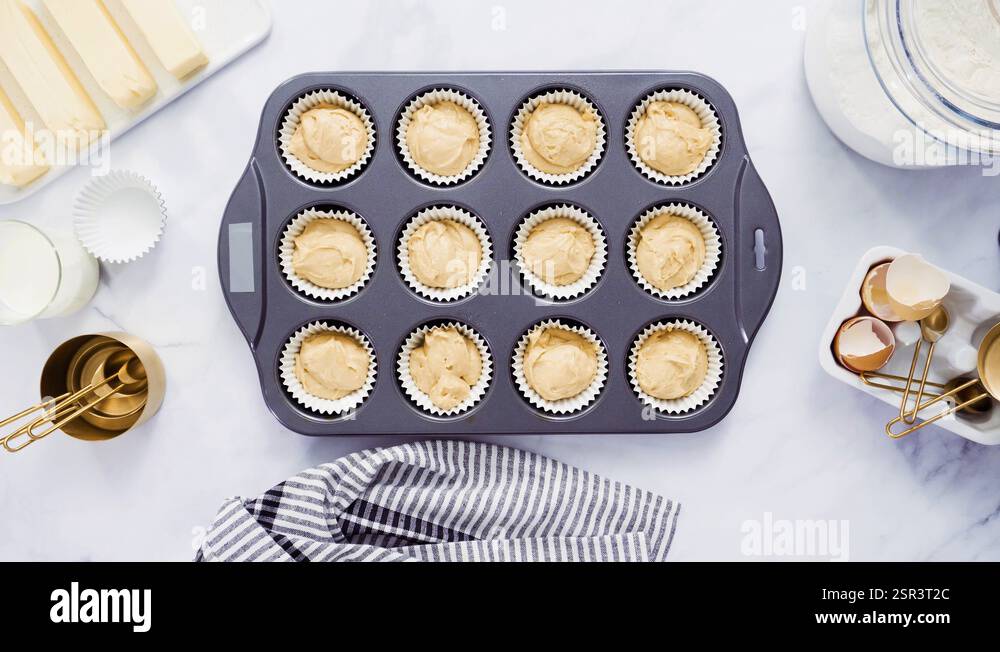 Flat lay. Step by step. Baking vanilla cupcakes in metal cupcake pan ...