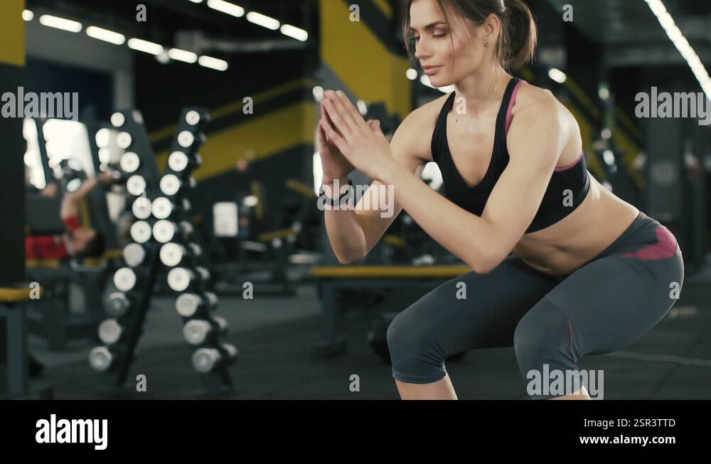 Fit girl doing exercises at gym background Stock Video Footage - Alamy
