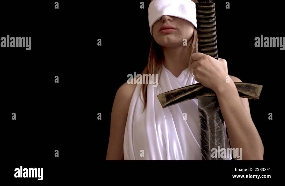 woman Greek goddess of justice Femida with sword in hand and scales on ...