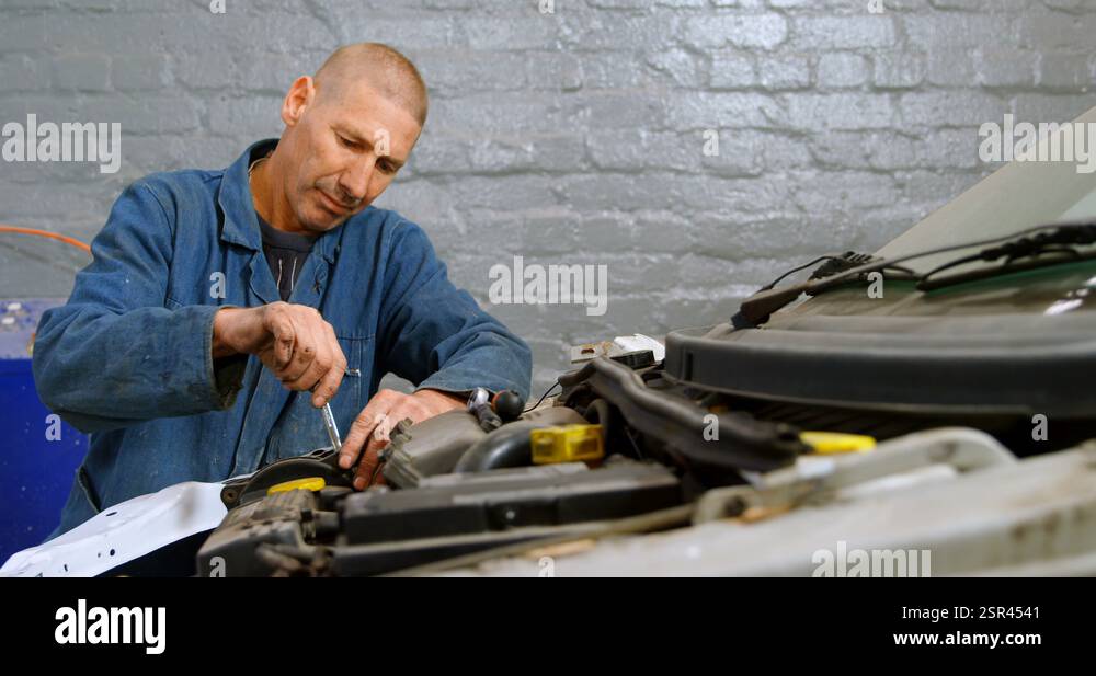Mechanic repairing a car engine 4k Stock Video Footage - Alamy