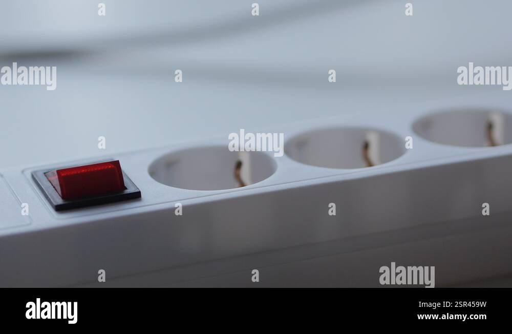 Male Hand Plugs In The Plug In Socket Electric Extension Cord And Turn ...