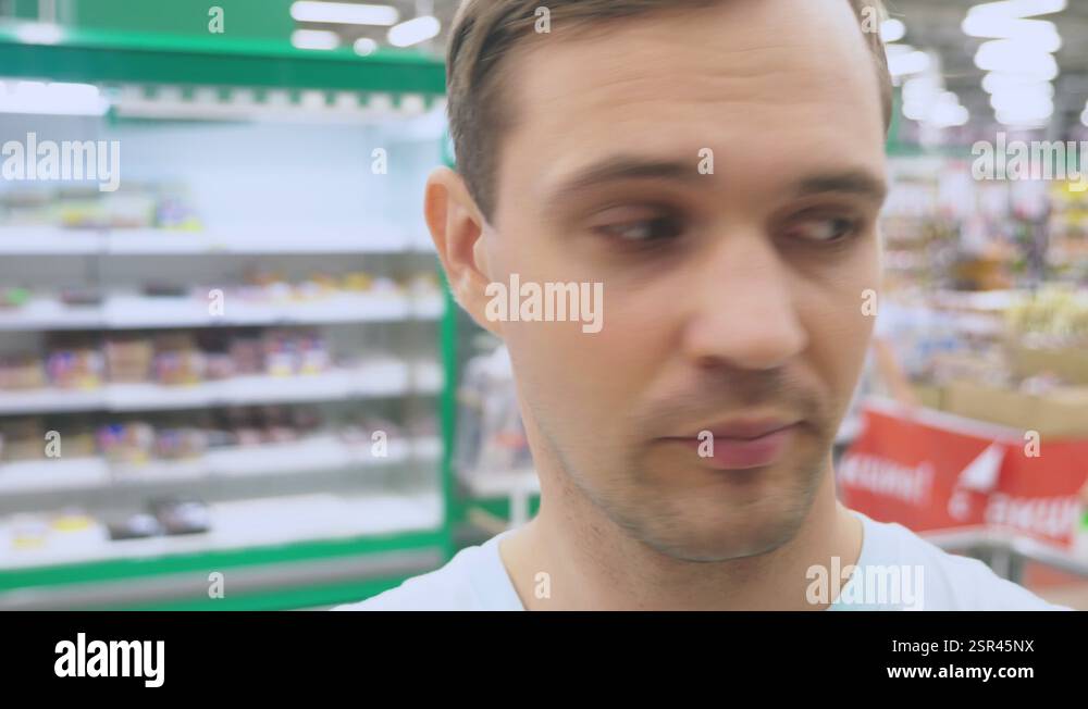 the buyer man is waiting in line at the cashier in the mall. background ...