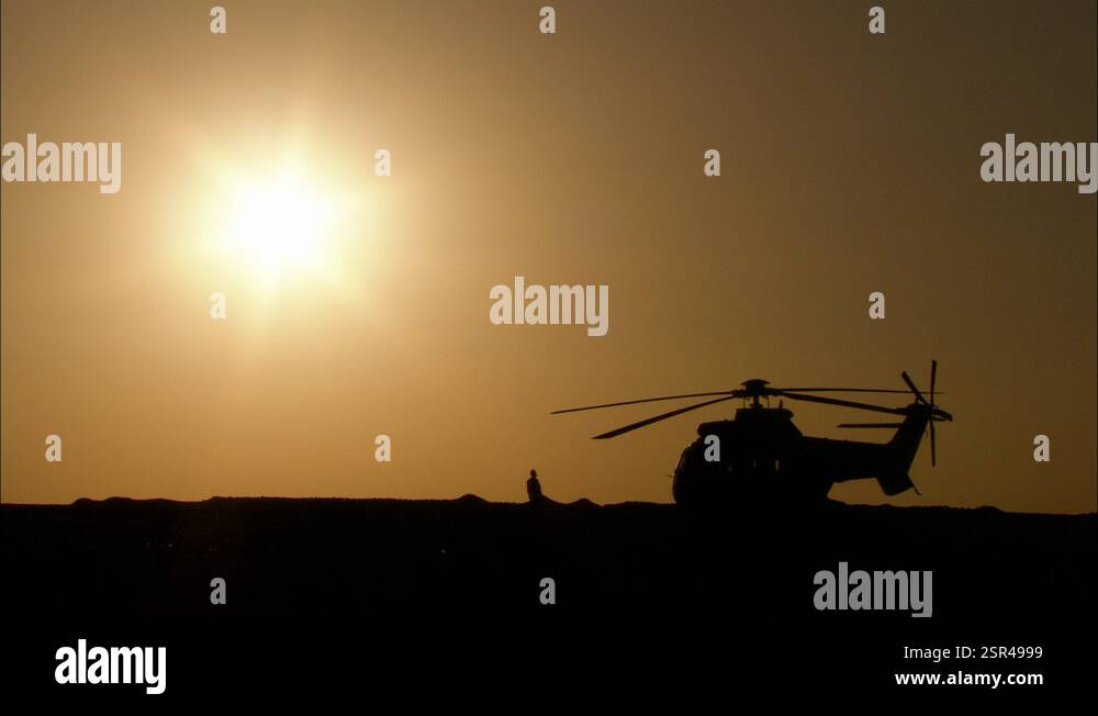 Helicopter and human silhouette with sun behind Stock Video Footage - Alamy