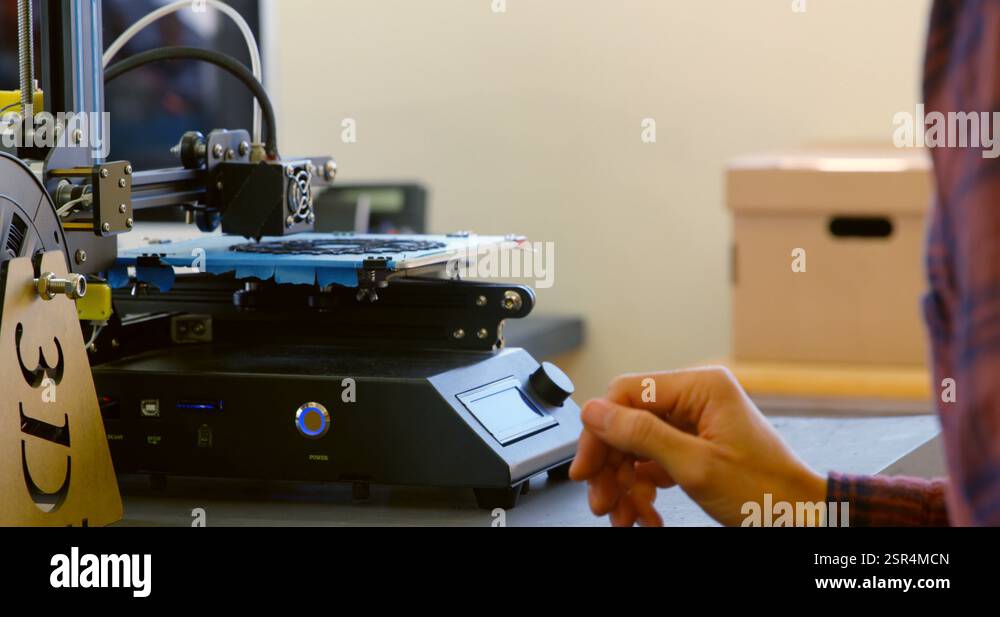 Mechanic using die machine on table 4k Stock Video Footage - Alamy