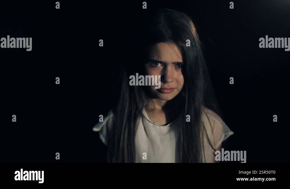 A young beautiful girl crying. Sad. Scared. White dress. Close-up. Long ...