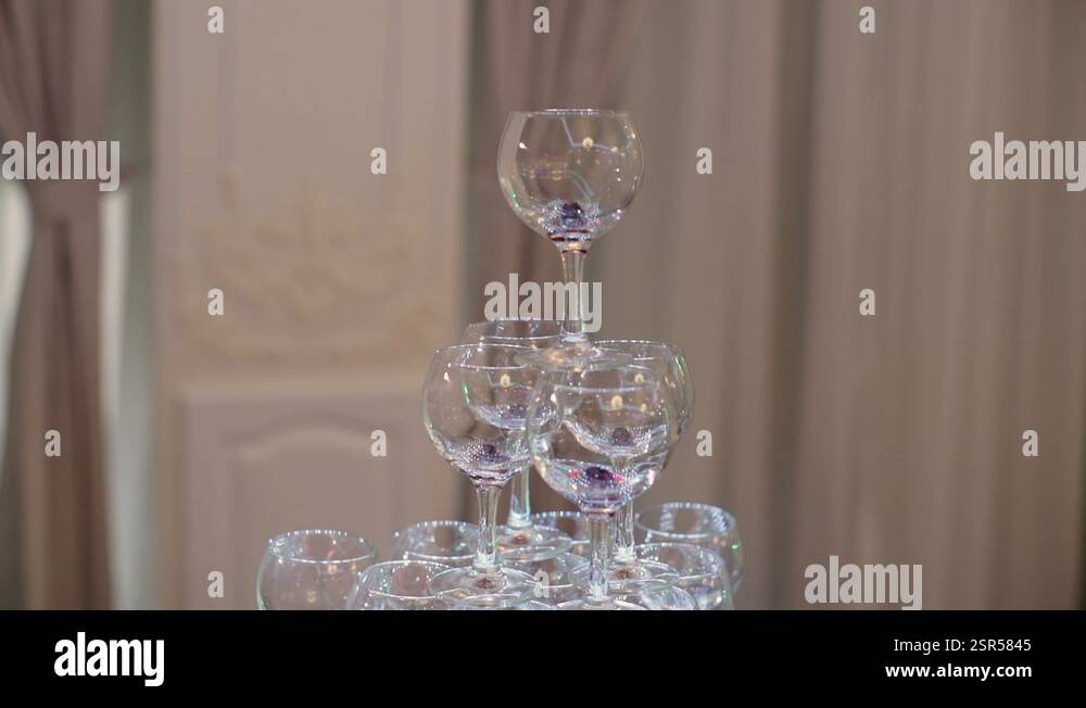 Pyramid of glasses of wine or champagne Stock Video Footage - Alamy