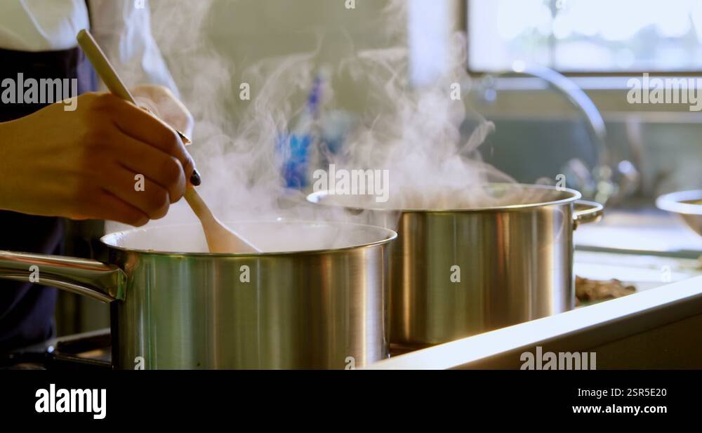 Female chef testing meal while cooking in kitchen 4k Stock Video ...