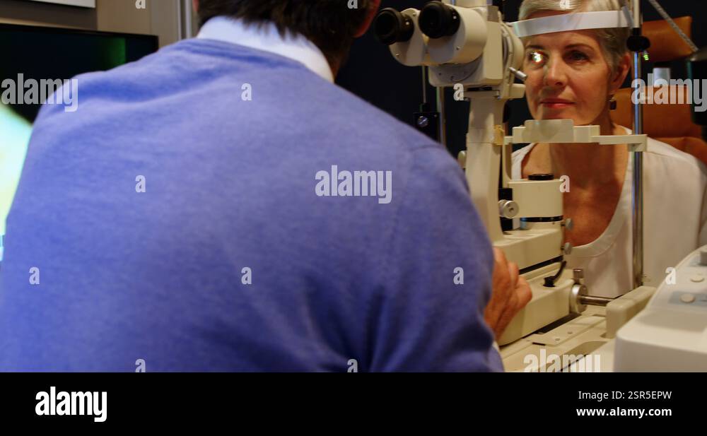 Optometrist examining patient eyes with slit lamp 4k Stock Video Footage - Alamy