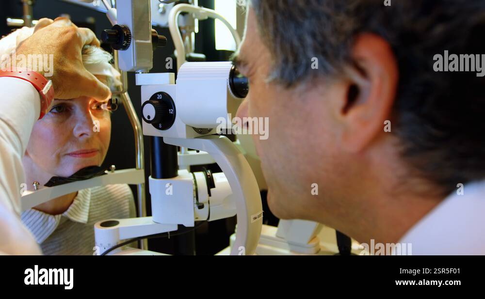 Optometrist examining patient eyes with slit lamp 4k Stock Video Footage - Alamy