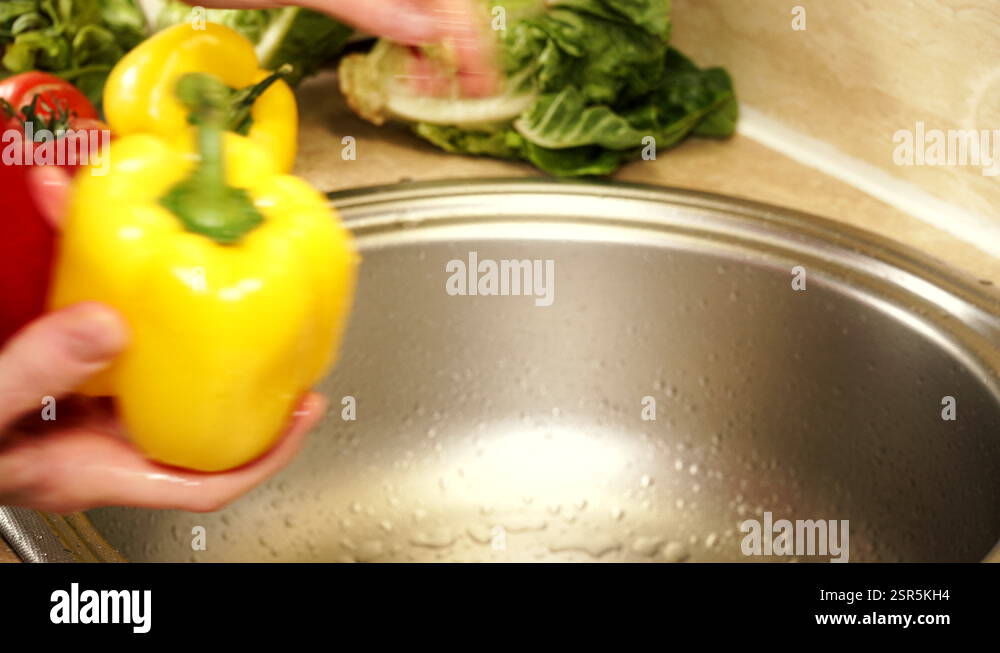 Hand washing bell pepper vegetable in kitchen sink Stock Video Footage ...