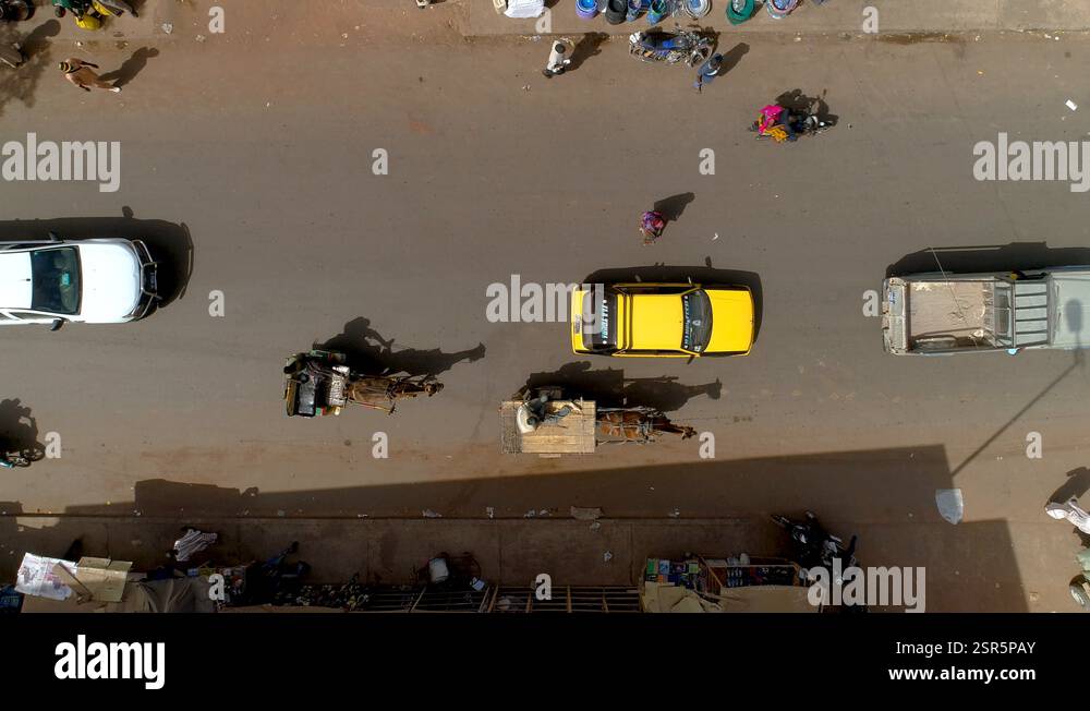 Buckboards Cars Motorbikes traffic jam in senegal africa aerial ...