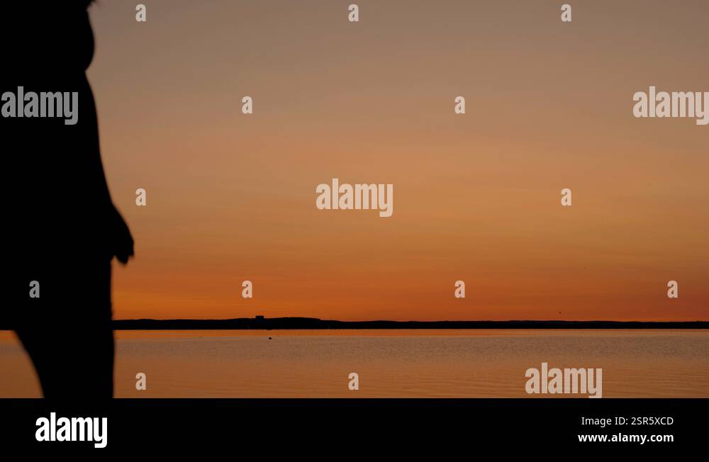 Happy Woman Runs To The Sunset To The Beach Raising Her Arms Up And ...
