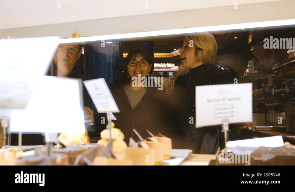 People shopping for sweets at Christian Bakery store on Rue de l'Outre ...