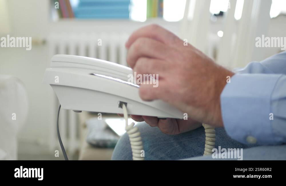 Man Sitting on a Chair in Office Room Answer to a Telephone Call Stock ...
