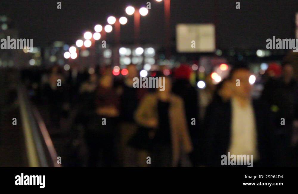 crowd rush hour city defocussed crowd walking across bridge Anonymous ...