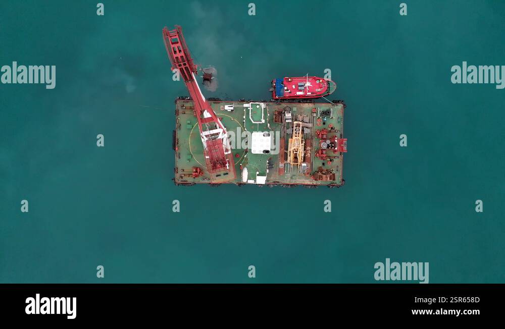 Offshore industrial platform or tower with crane or science sea ...