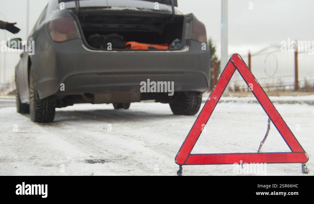 Winter Driving. Car Trouble. An emergency sign. Car trouble on a snowy ...