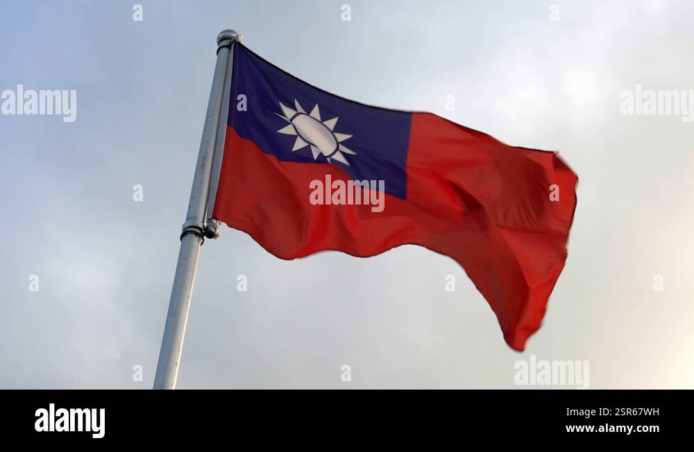 Slow motion taiwanese flag waving in the wind on flagpole at an Taipei ...