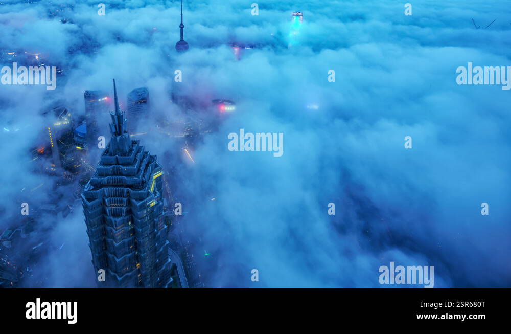 China Shanghai, over the sea of clouds, aerial view of the modern ...