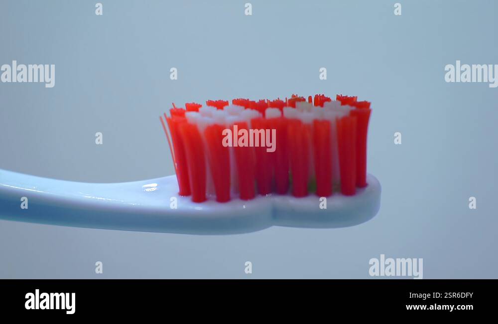 toothbrush and toothpaste closeup Stock Video Footage - Alamy