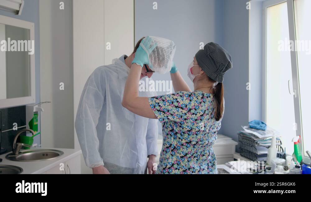 Hospital Nurse is Preparing and Dressing a Patient before Orthodontic ...