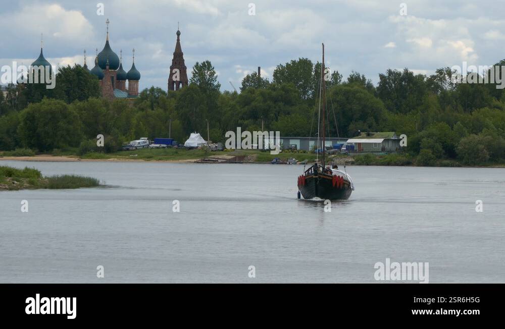 An old style Russian wind boat in Kotorosl river Church of St. John ...