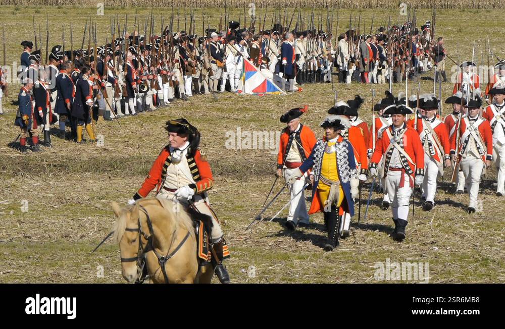 British Redcoats marching in formation with muskets and flags - re ...