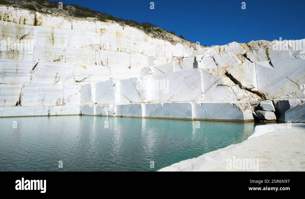 Artificial lake with clear turquoise water, formed in a marble quarry ...