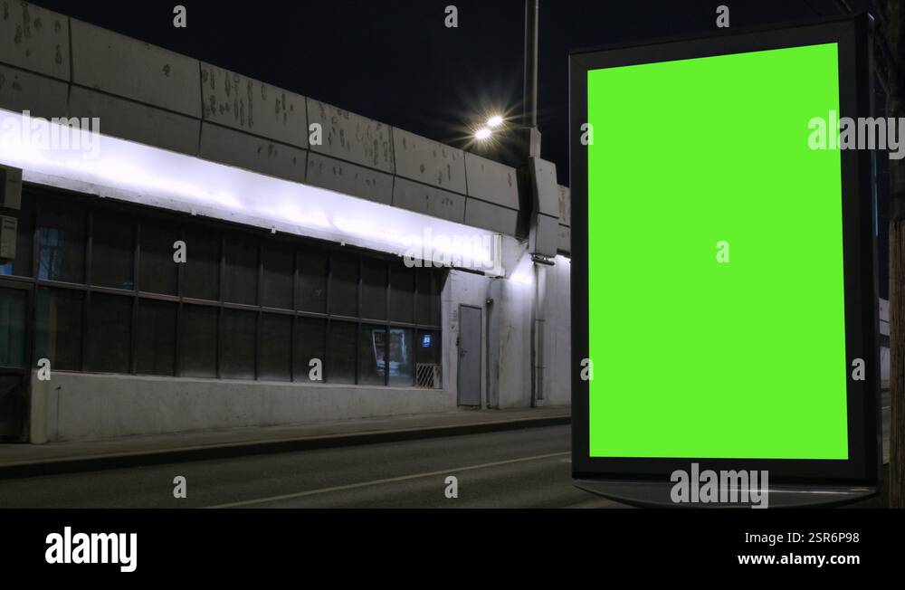 Time lapse. Billboard with a green screen, located on a busy street ...