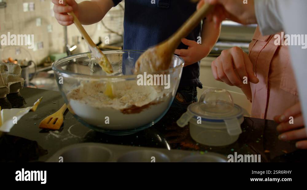 Cute siblings mixing the dough in the bowl in kitchen 4k Stock Video ...