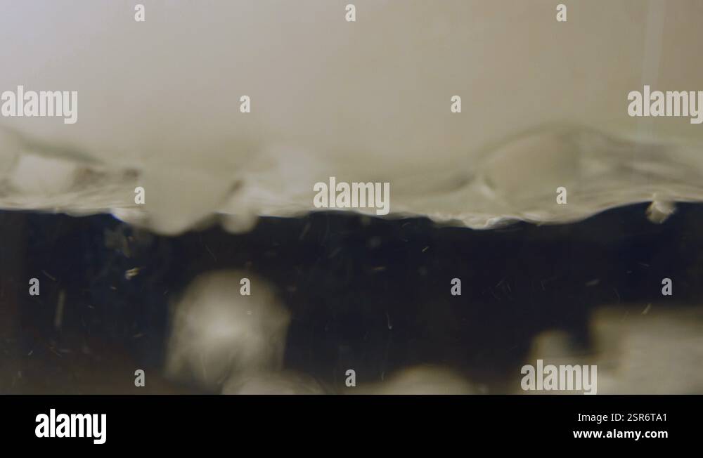 Gas Rising to Top of Liquid Surface Stock Video Footage - Alamy