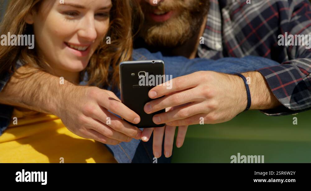 Close-up of young couple discussing on mobile phone 4k Stock Video ...