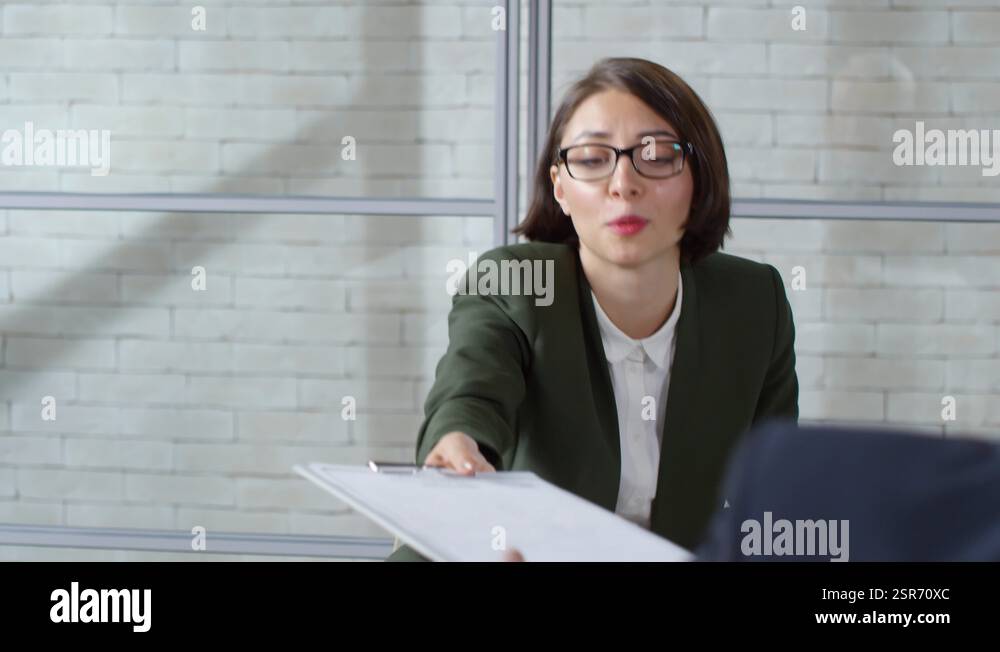 Woman Introducing Herself to Businesspeople during Job Interview Stock ...