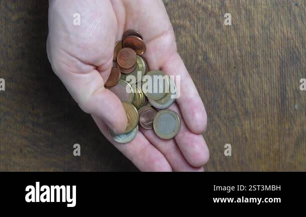 Male hands holding and counting euro coins, close up. Hands hold euro ...