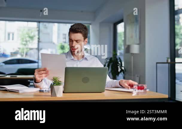 Business manager reading report at modern workspace closeup. Focused ...