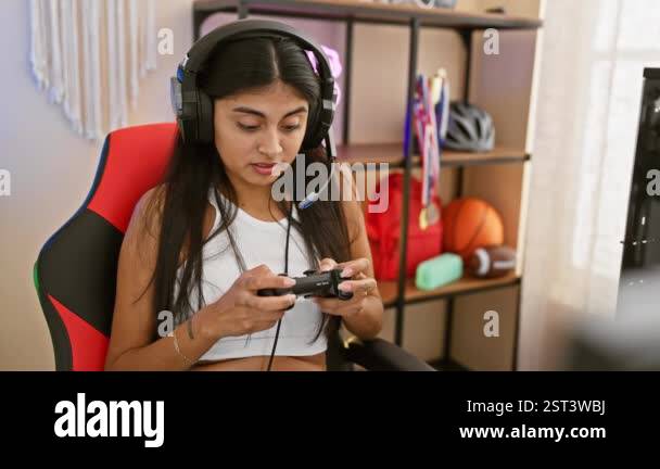Smiling young indian woman gestures an 'ok' sign, expressing joy and ...