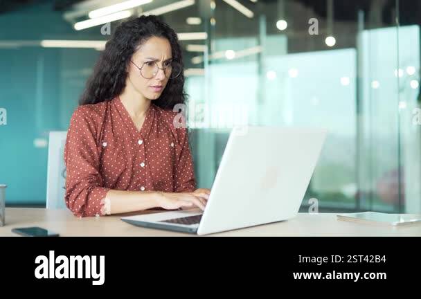 Worried businesswoman having problems with software or service on ...