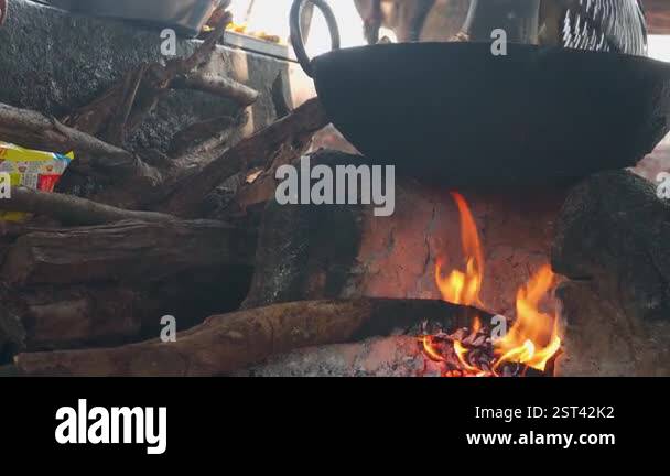 Cinematic shot of traditional Indian cooking of deep-fried pakoras on a ...