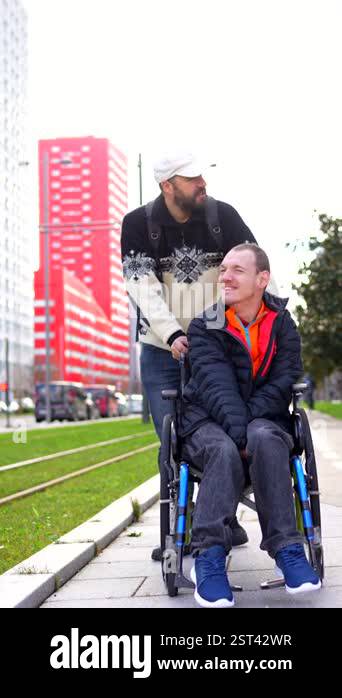 Man providing supportive mobility assistance, navigating urban sidewalk ...