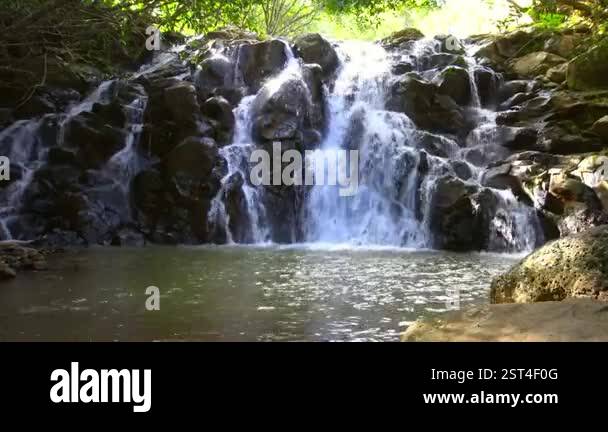 Cascading Cascade: A Majestic Waterfall Tumbling Over Rocks Stock Video ...