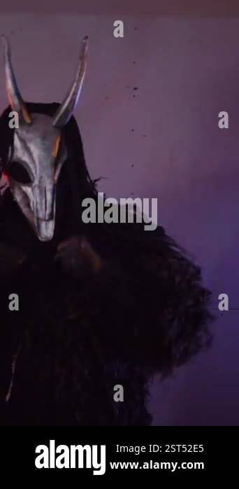 Vertical, The devil monster dances with RGB sticks in his hands. A ...