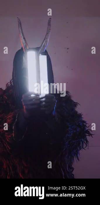 Vertical, The devil monster dances with RGB sticks in his hands. A ...