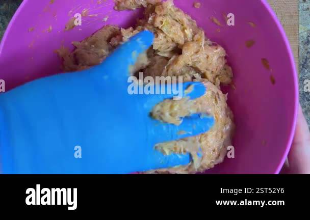 Mixing minced chicken in a bowl with your hand. Making chicken ...