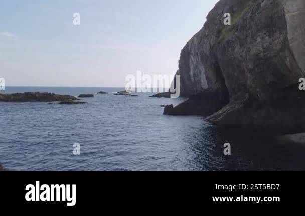 Ocean Close-Up: Zoomed View of Blue Sea Waves Crashing on Rocks Stock ...