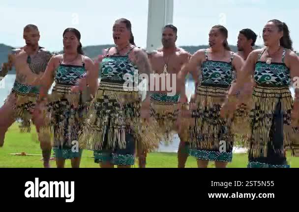 WAITANGI, NZL - FEB 06 2025:Group of Maori people singing and dancing traditional Haka dance on ...