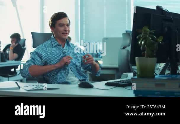 Rested and ready-to-work guy coming to work after weekend. Computer ...